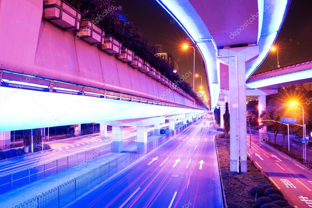 Illuminated traffic on elevated expressway in city. Stock Photo by ...