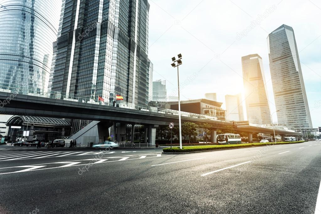 Skyline, road and office buildings at sunset — Stock Photo © zhudifeng ...