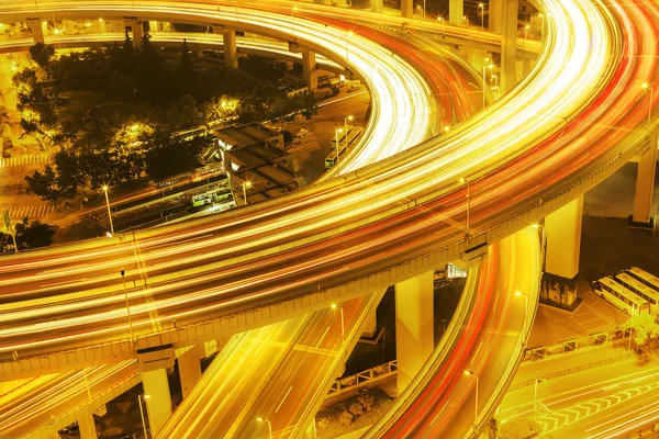 illuminated road intersection and traffic trails - Stock Image - Everypixel