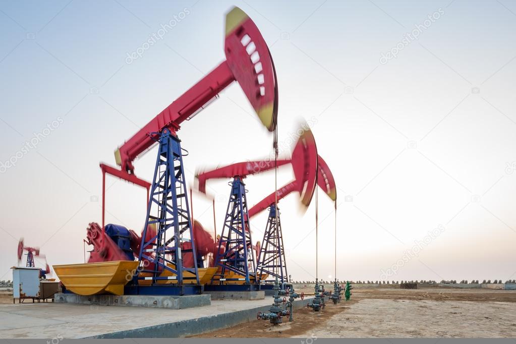 Oil field with pump units Stock Photo by ©zhudifeng 89183182
