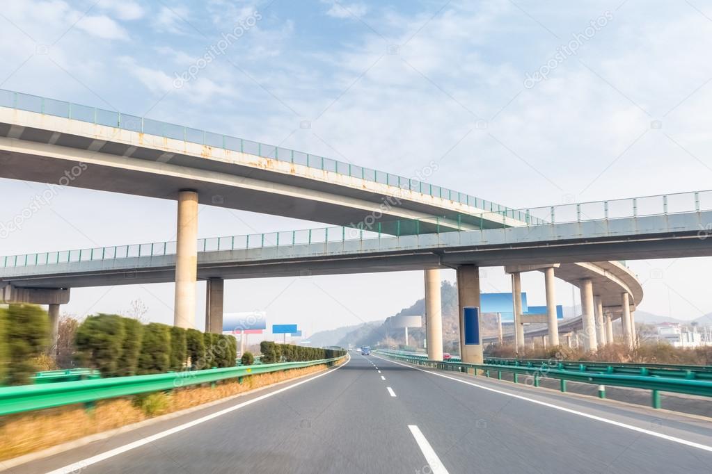 Modern freeways with highway overpass — Stock Photo © chungking #119320234
