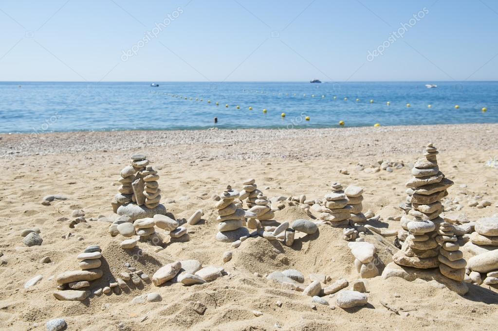 Stacked stones at the beach Stock Photo by ©ivonnewierink 112451880