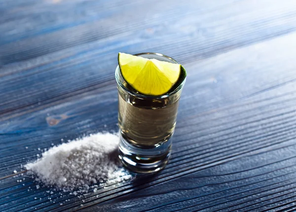 Tequila with salt and lime Stock Photo by ©igorr1 105139656
