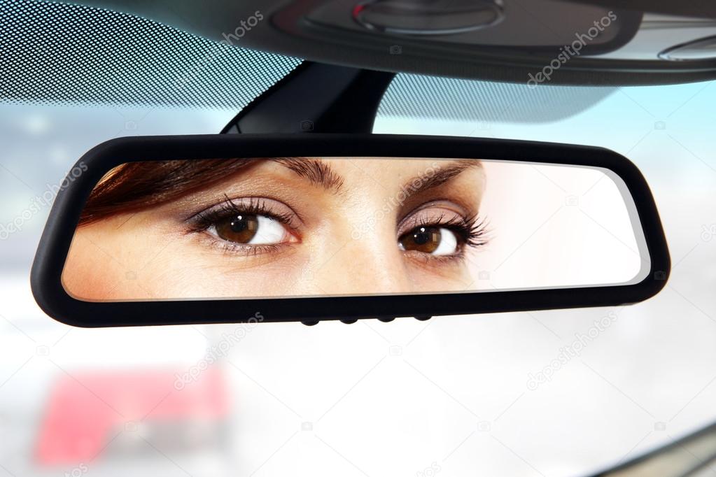 Driver looks to rear-view mirror Stock Photo by ©ssuaphoto 90157816