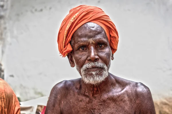 Holy Sadhu men in saffron color clothing blessing in Shiva Temple ...