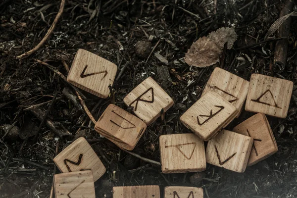Wooden runes on the ground — Stock Photo © Alexandra Lande #70869087