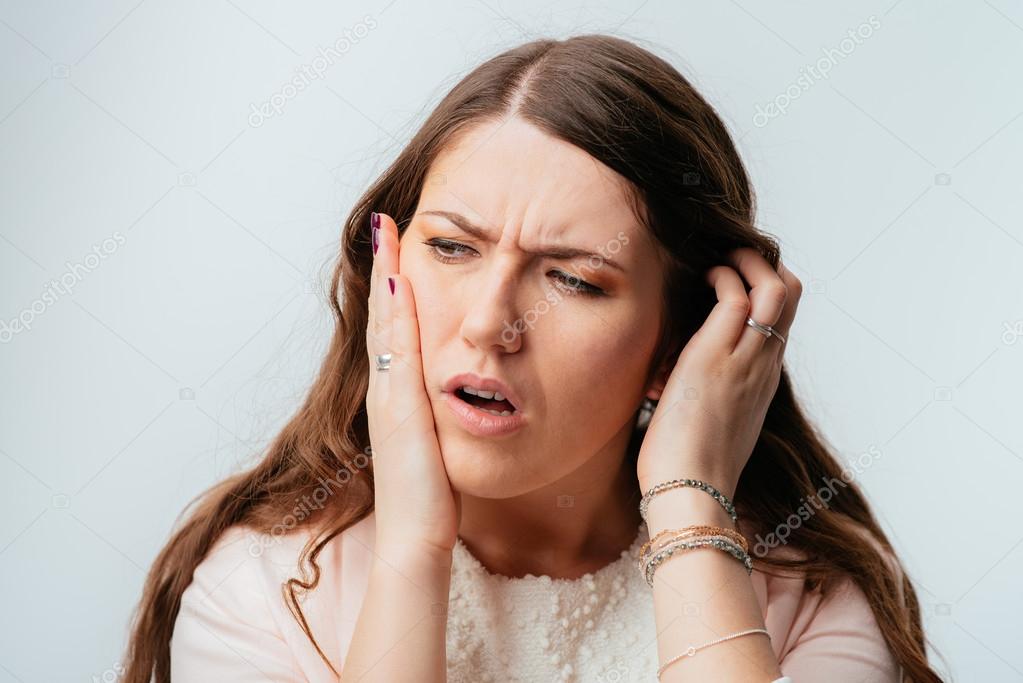 Woman pressing her bruised cheek Stock Photo by ©file404 113650978