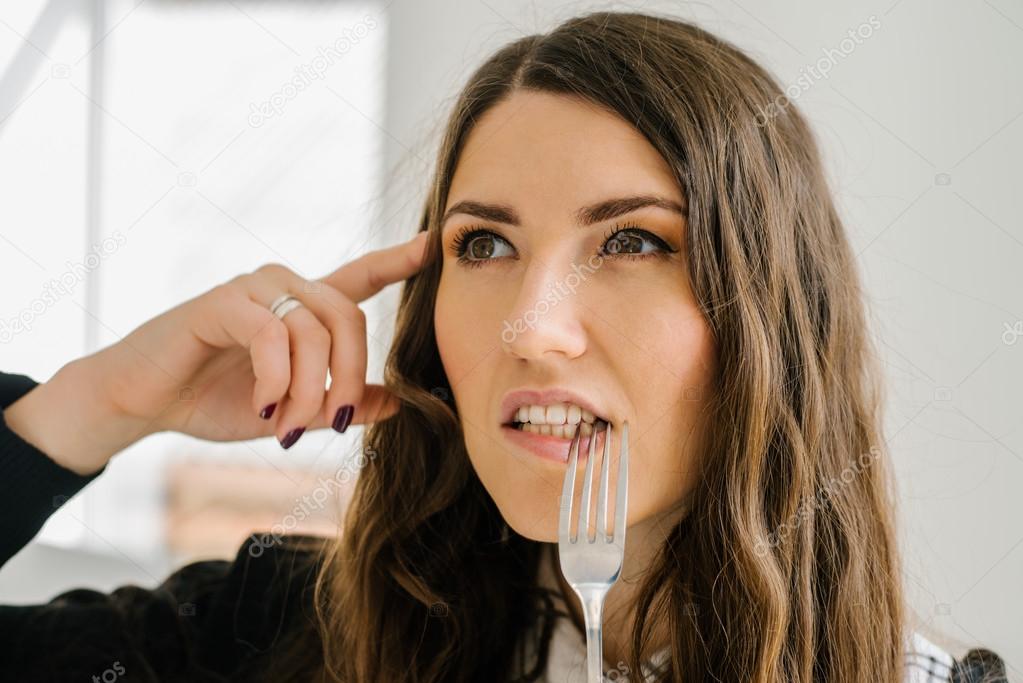 Girl with an empty fork Stock Photo by ©file404 113652536