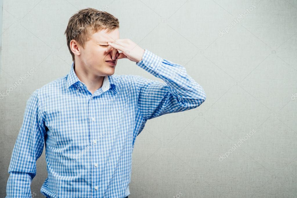 Man closes his nose Stock Photo by ©file404 114086236
