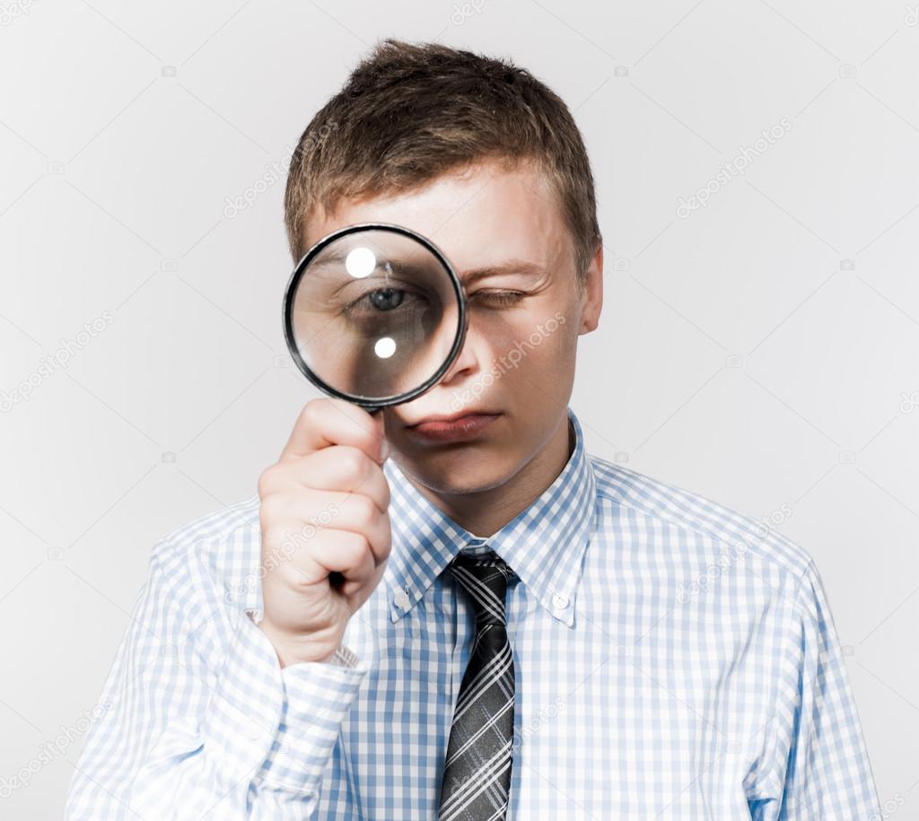 Man with a magnifying glass Stock Photo by ©file404 114086284