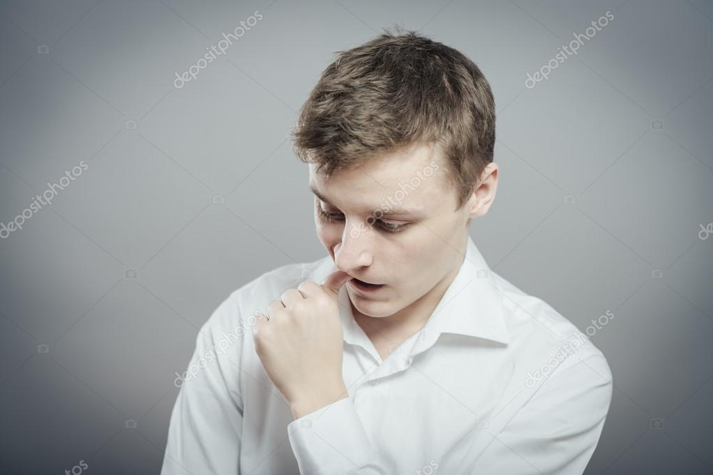 Man nibbling his fingernails Stock Photo by ©file404 114086472