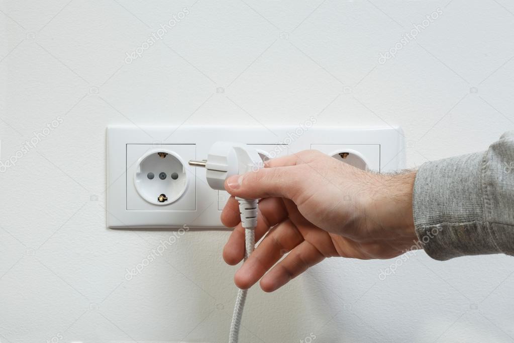 Plugging electrical cable to socket — Stock Photo © svetlovskiy #59796243