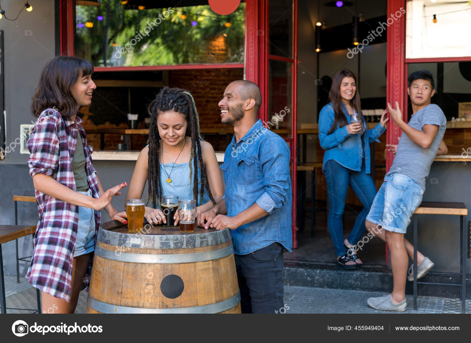 Friends in a bar having fun Stock Photo by ©Spectral 455949404