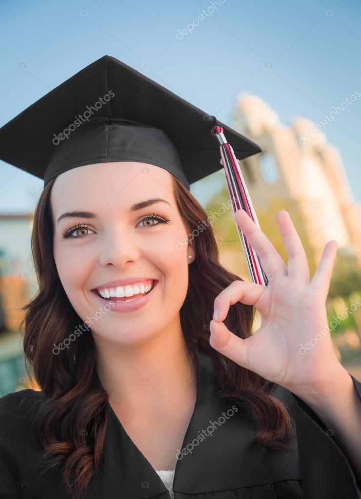 Happy Graduating Mixed Race Woman In Cap and Gown — Stock Photo © Feverpitch #119916744