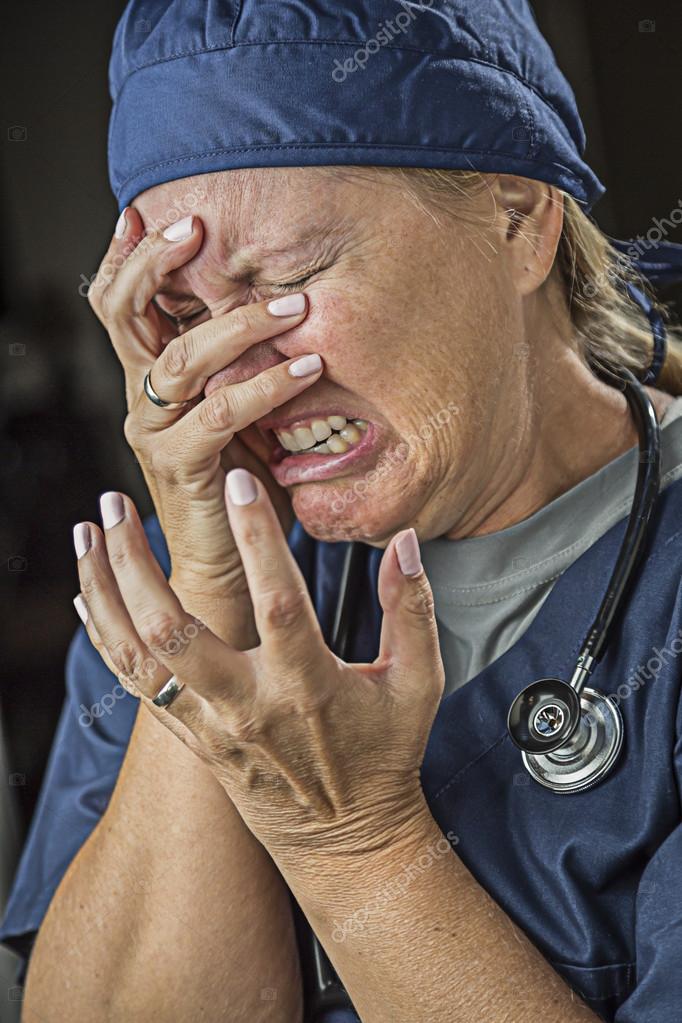 Agonizing Crying Female Doctor or Nurse Stock Photo by ©Feverpitch 55935019