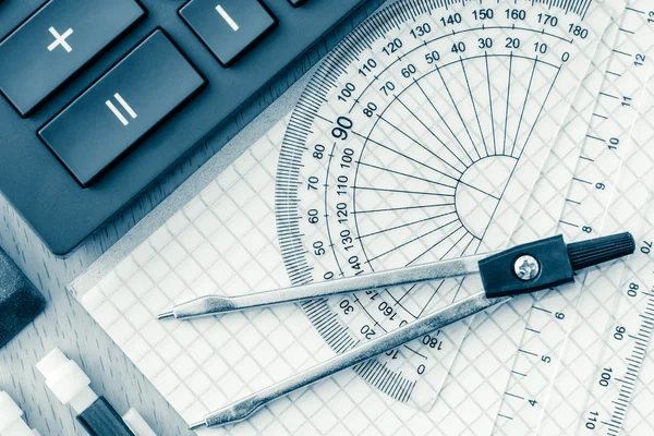 School supplies used in math toned in blue Stock Photo by ©kmiragaya ...