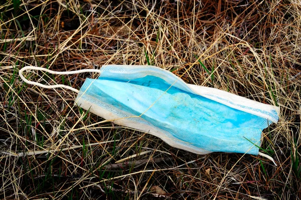 Discarded facemask face mask for covid 19 coronavirus in weeks garbage ...