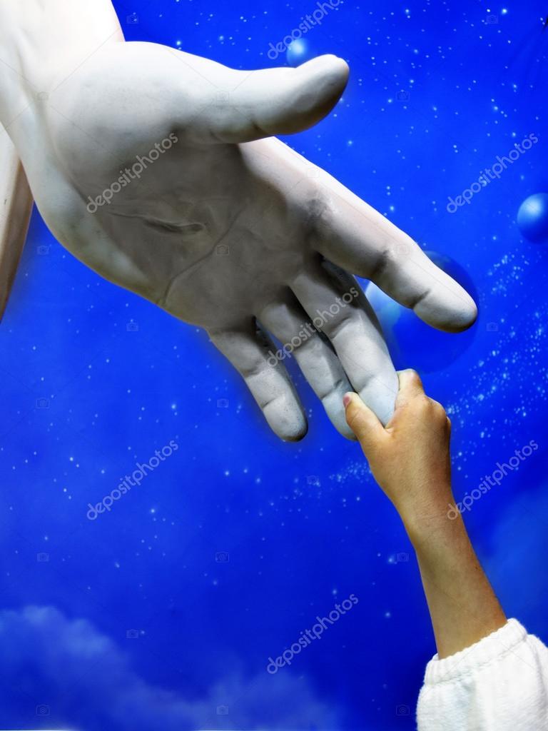 Child Holding Hand of Jesus Statue Stock Photo by ©eric1513 62180735