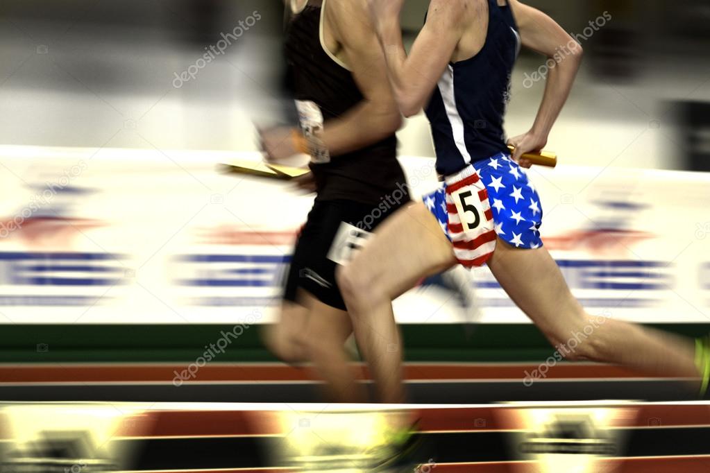 Running a Relay Race on Tract Flag Shorts — Stock Photo © eric1513 ...