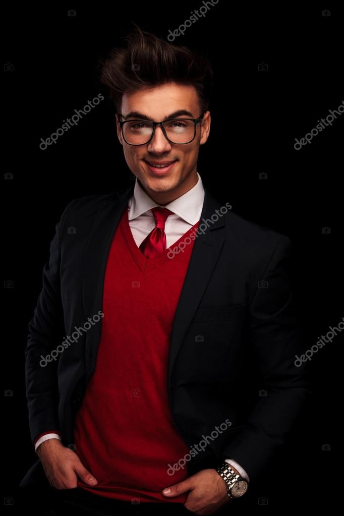 Classy model in black suit with hands in pockets Stock Photo by ...