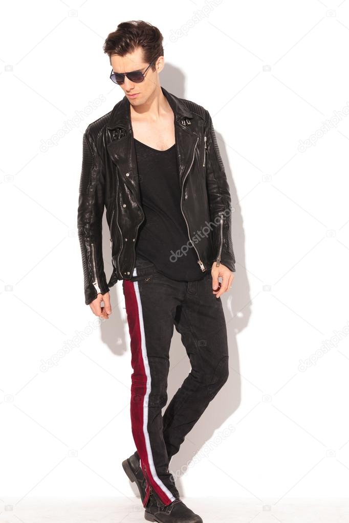 Rocker man in leather jacket and sunglasses walking Stock Photo by ...