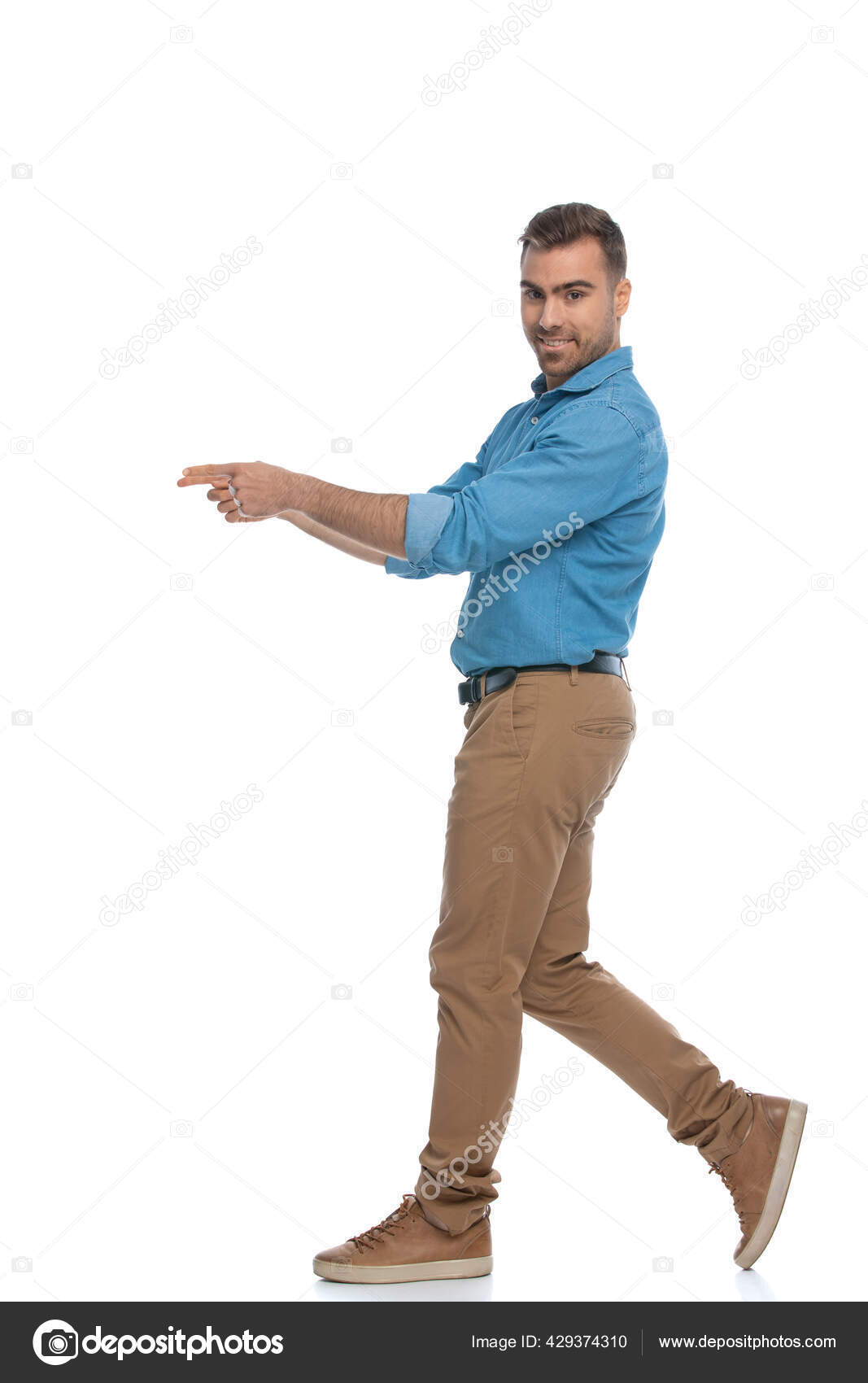 Casual Attractive Man Walking Pointing One Way While Looking Other ...