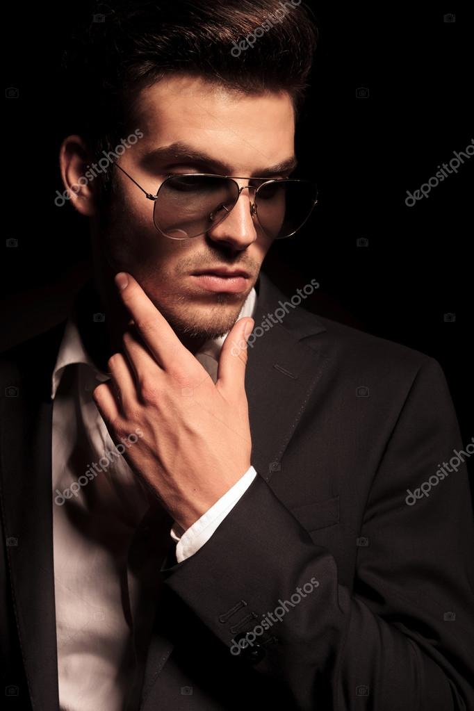 Dramatic pensive young man — Stock Photo © feedough #52425307 Dramatic pensive young man — Stock Photo © feedough #52425307