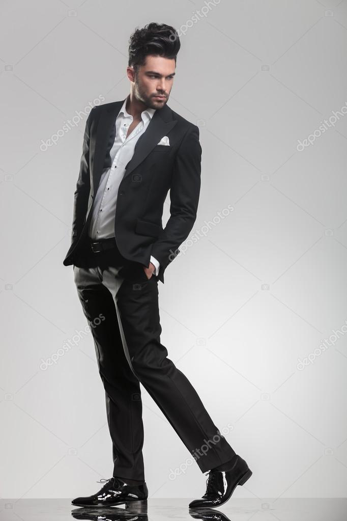 Elegant young man looking away from the camera — Stock Photo © feedough ...