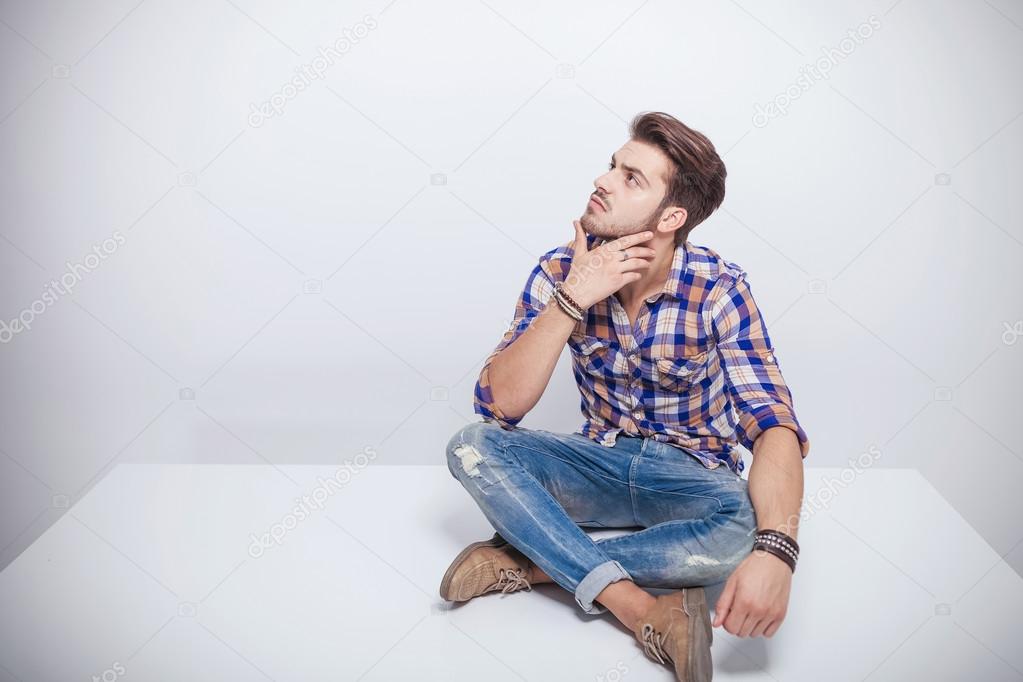 Handsome young man thinking while looking up. — Stock Photo © feedough ...