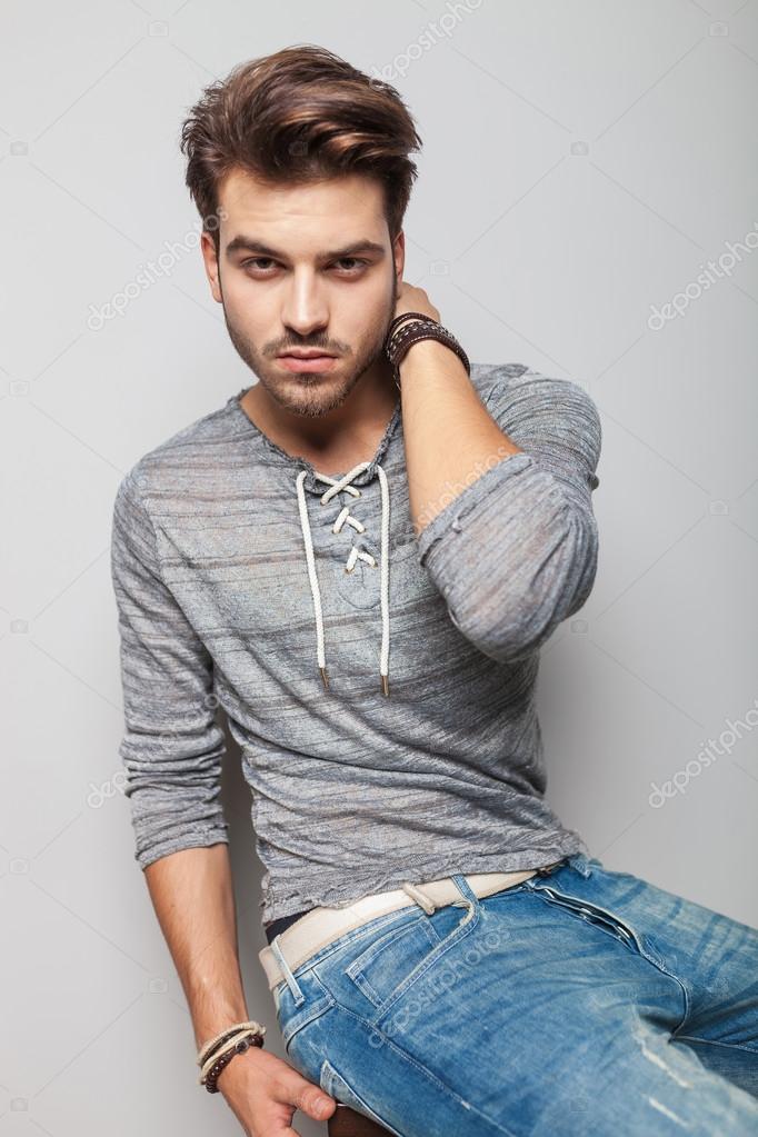 Fashion man sitting on a stool — Stock Photo © feedough #55943419 Fashion man sitting on a stool — Stock Photo © feedough #55943419