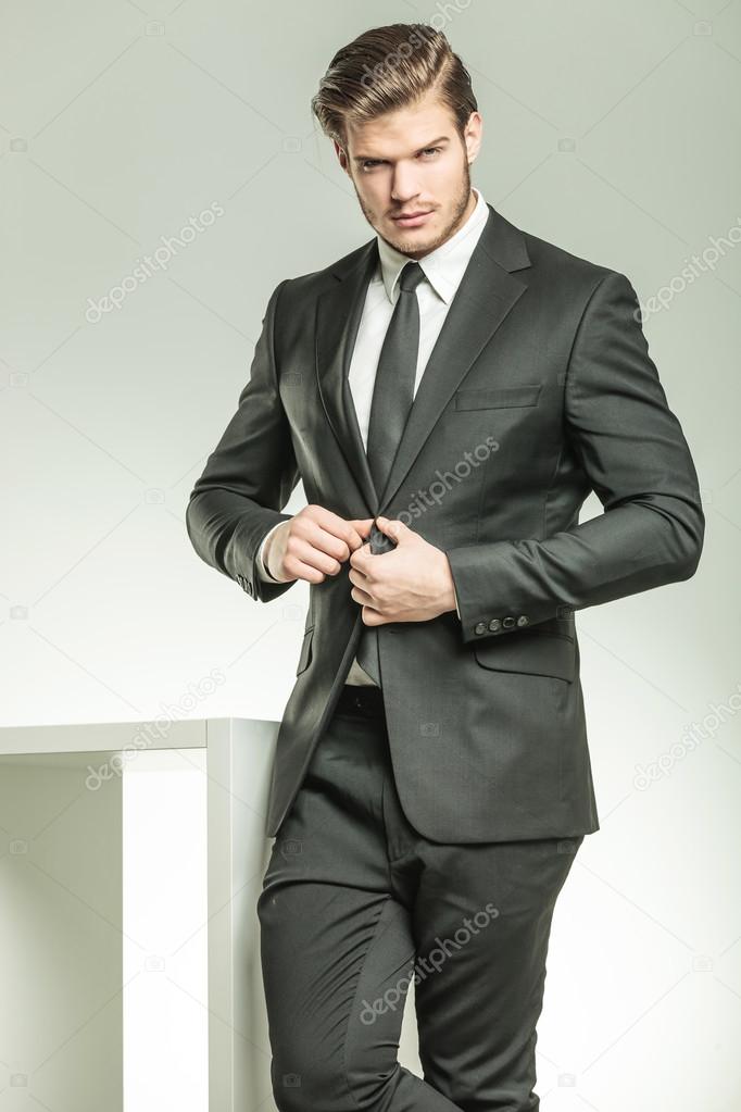 Handsome elegant business man looking at the camera Stock Photo by ...