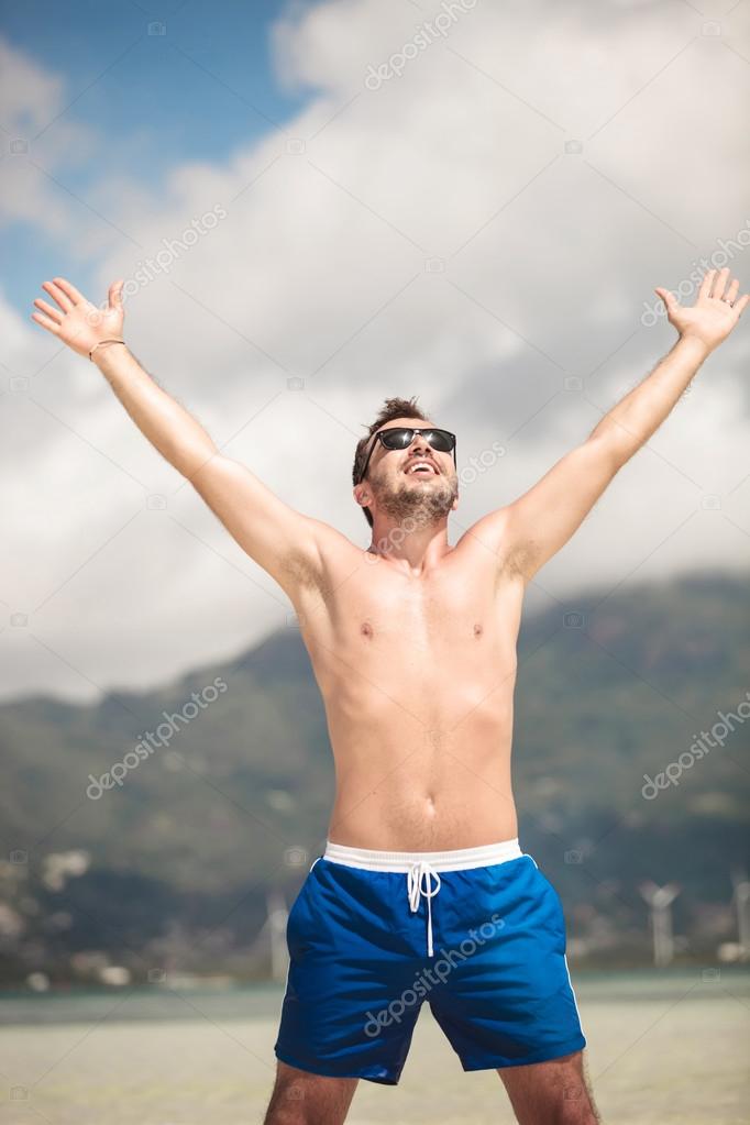 Young happy man enjoying his vacation Stock Photo by ©feedough 62662301