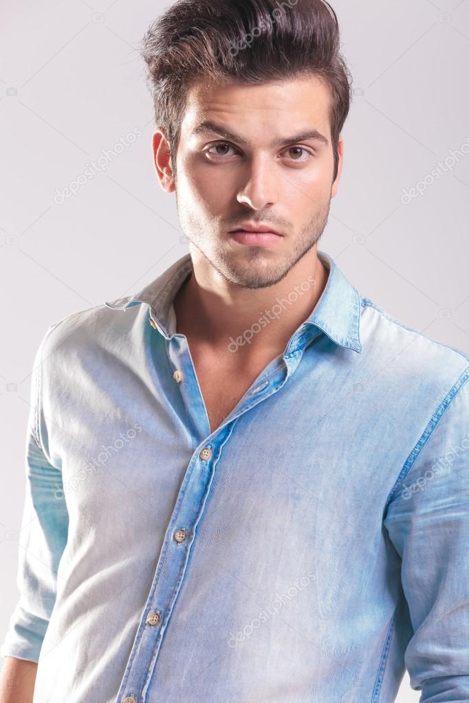 Young handsome man posing on grey studio background — Stock Photo ...