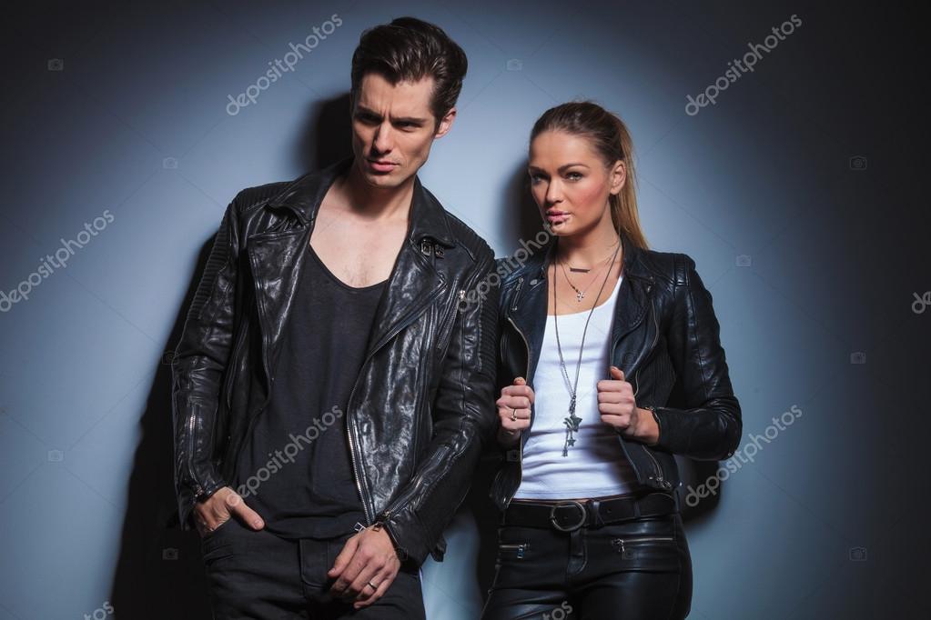 Rocker is looking away while his girlfriend is arranging her lea Stock ...