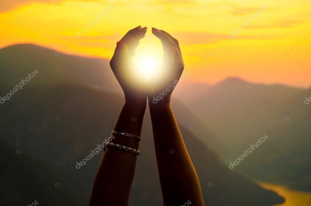 Female hands holding sun on sunny summer day Stock Photo by ...