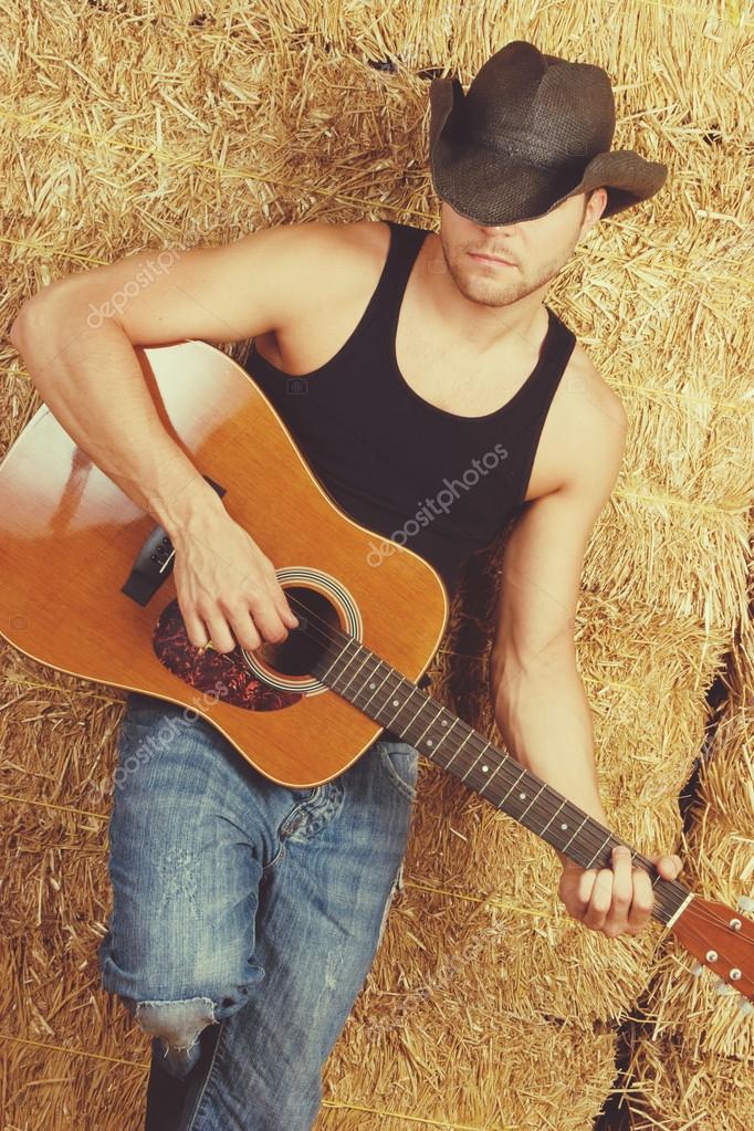 Cowboy Playing Guitar — Stock Photo © keeweeboy #123856524