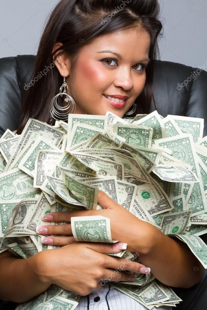 Woman Holding Money Stock Photo by ©keeweeboy 79521302