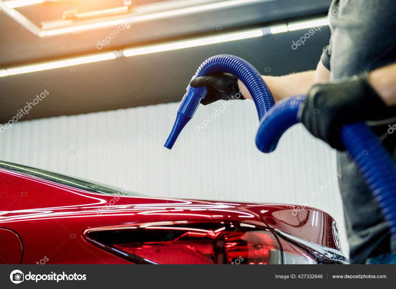Service worker makes automatic drying of the car after washing. Stock ...