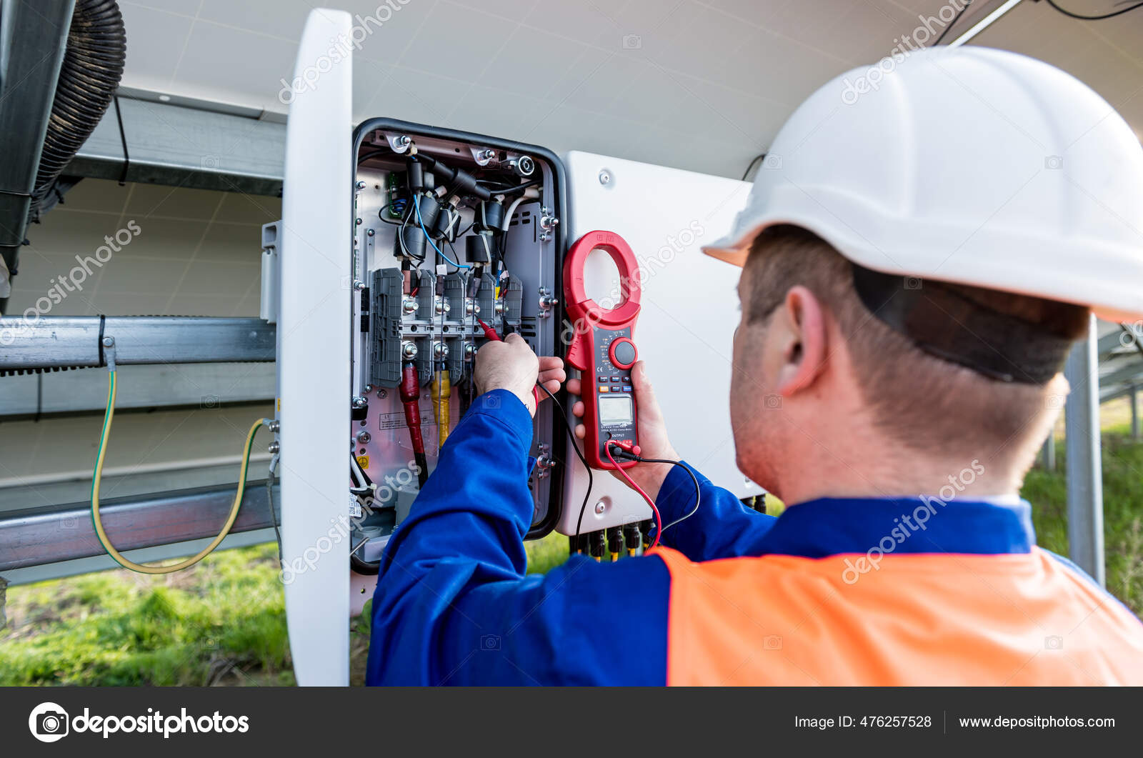 The inspector checks the actual output voltage level of inverter Stock ...