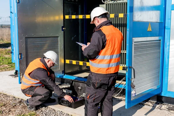 Execution of electrical measuring works on the power transformer Stock ...