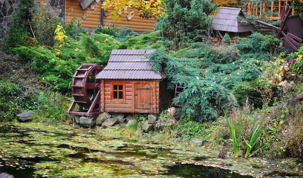 Little house model and mill on nature Stock Photo by ©NataliiaMelnyc ...