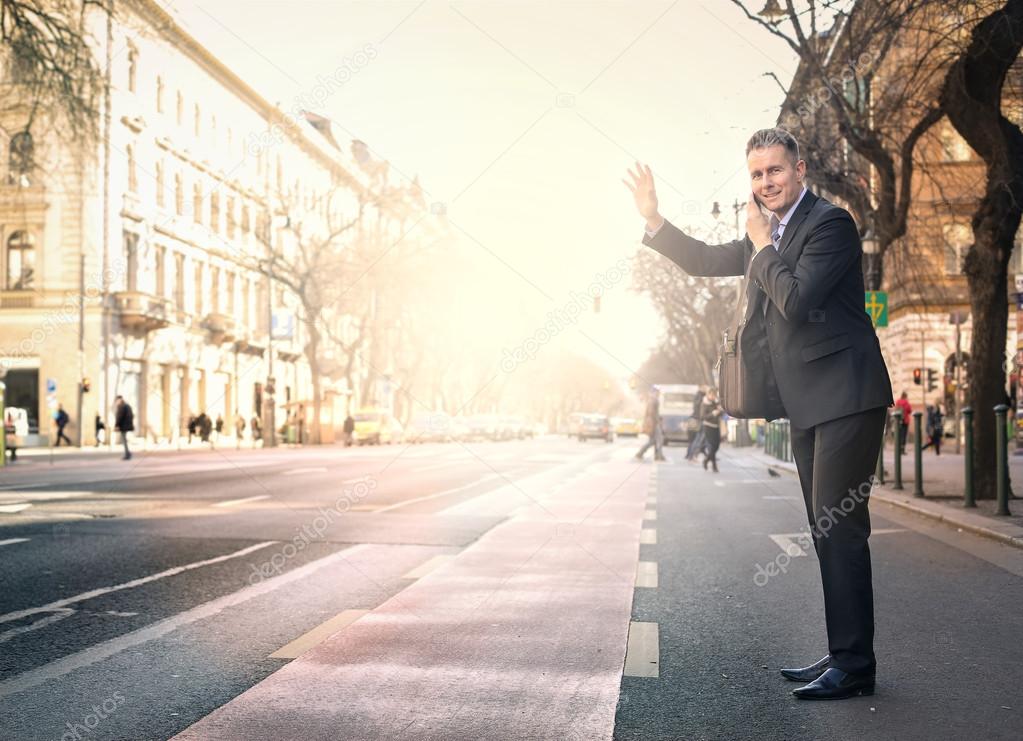 Calling for a taxi Stock Photo by ©olly18 73691799