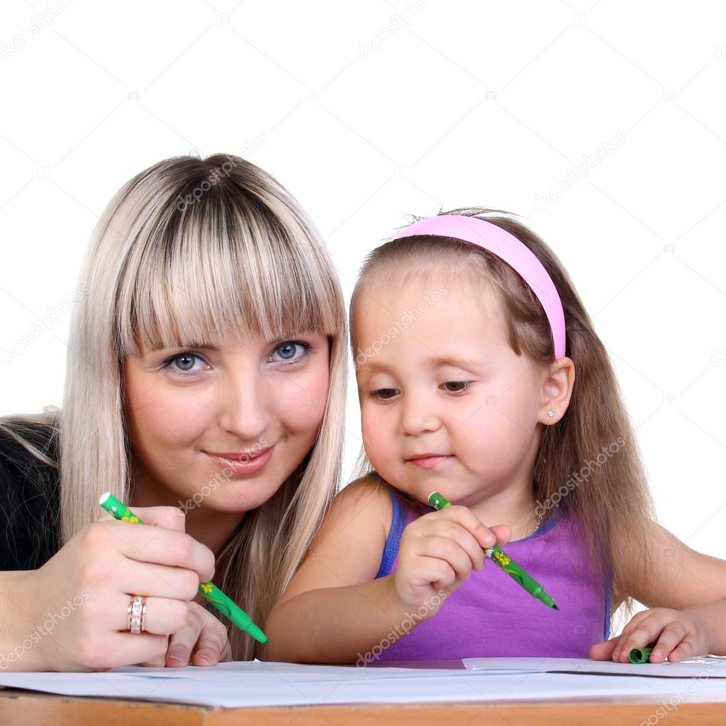 Mother teaching her daughter drawing — Stock Photo © lanych #78671882 Mother teaching her daughter drawing — Stock Photo © lanych #78671882