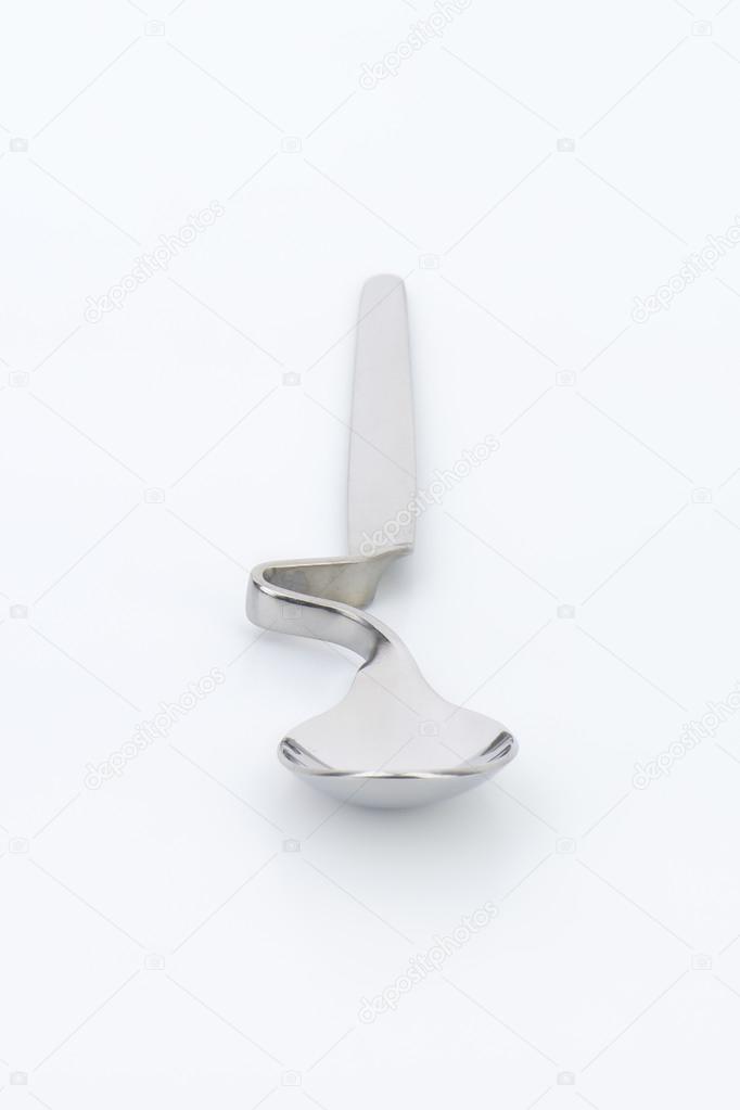 Metal twisted spoon Stock Photo by ©ajafoto 107784436