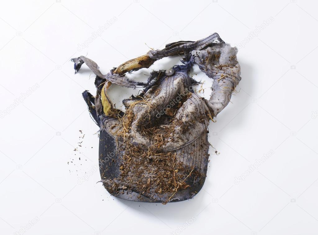 Torn jeans cap covered in dirt Stock Photo by ©ajafoto 80082638