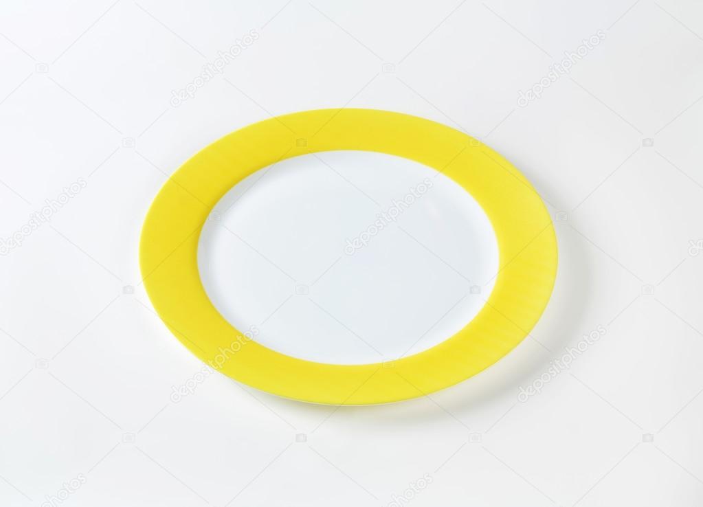 White plate with yellow rim — Stock Photo © ajafoto #84135900