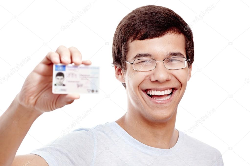 Guy with driving license Stock Photo by ©furtaev 98501486