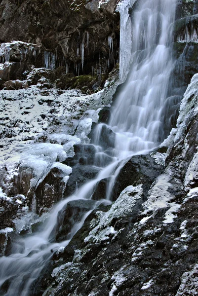 Waterfall in russian taiga, winter - Stock Image - Everypixel