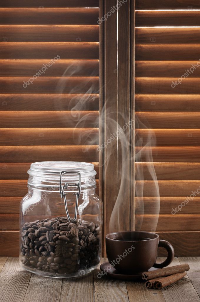 Hot coffee against shutters — Stock Photo © svl861 #90325734