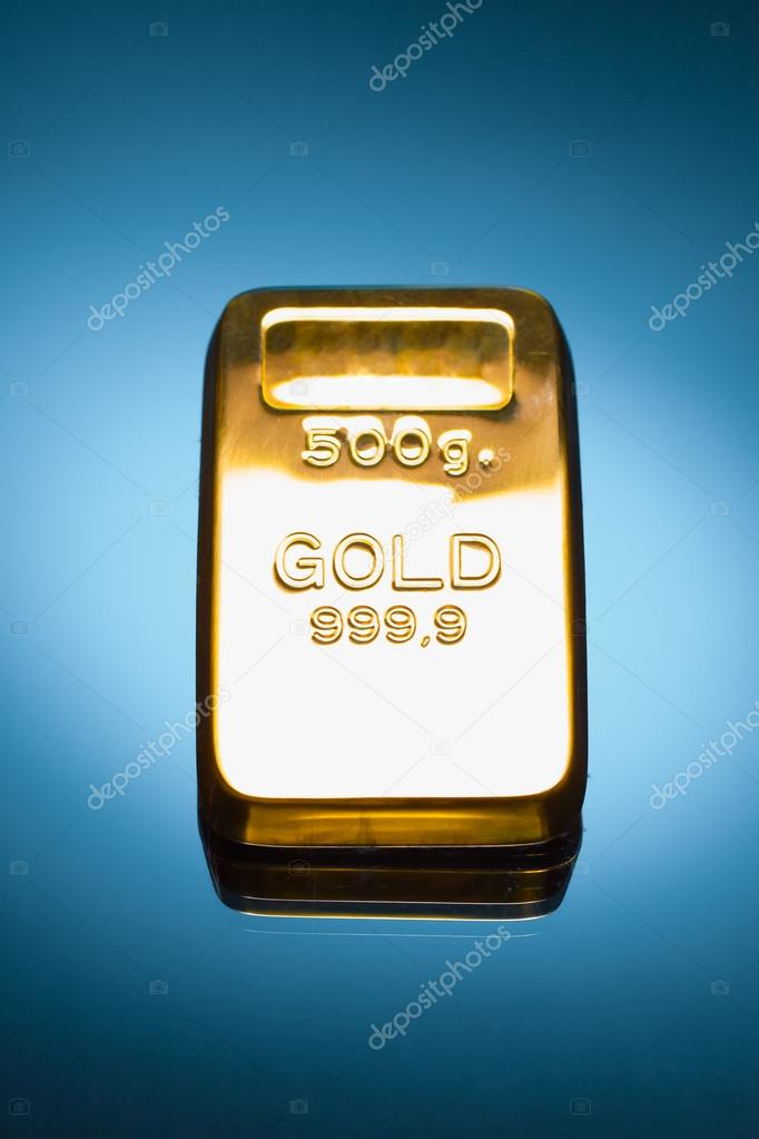 Gold bar against blue background Stock Photo by ©nikkytok 101483788